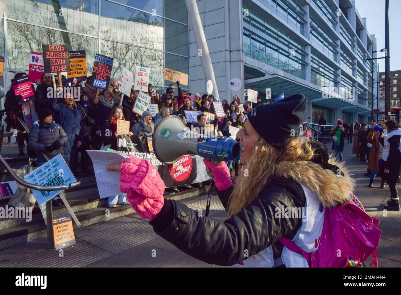 London, UK. 19th Jan, 2023. A nurse chants slogans through a megaphone ...