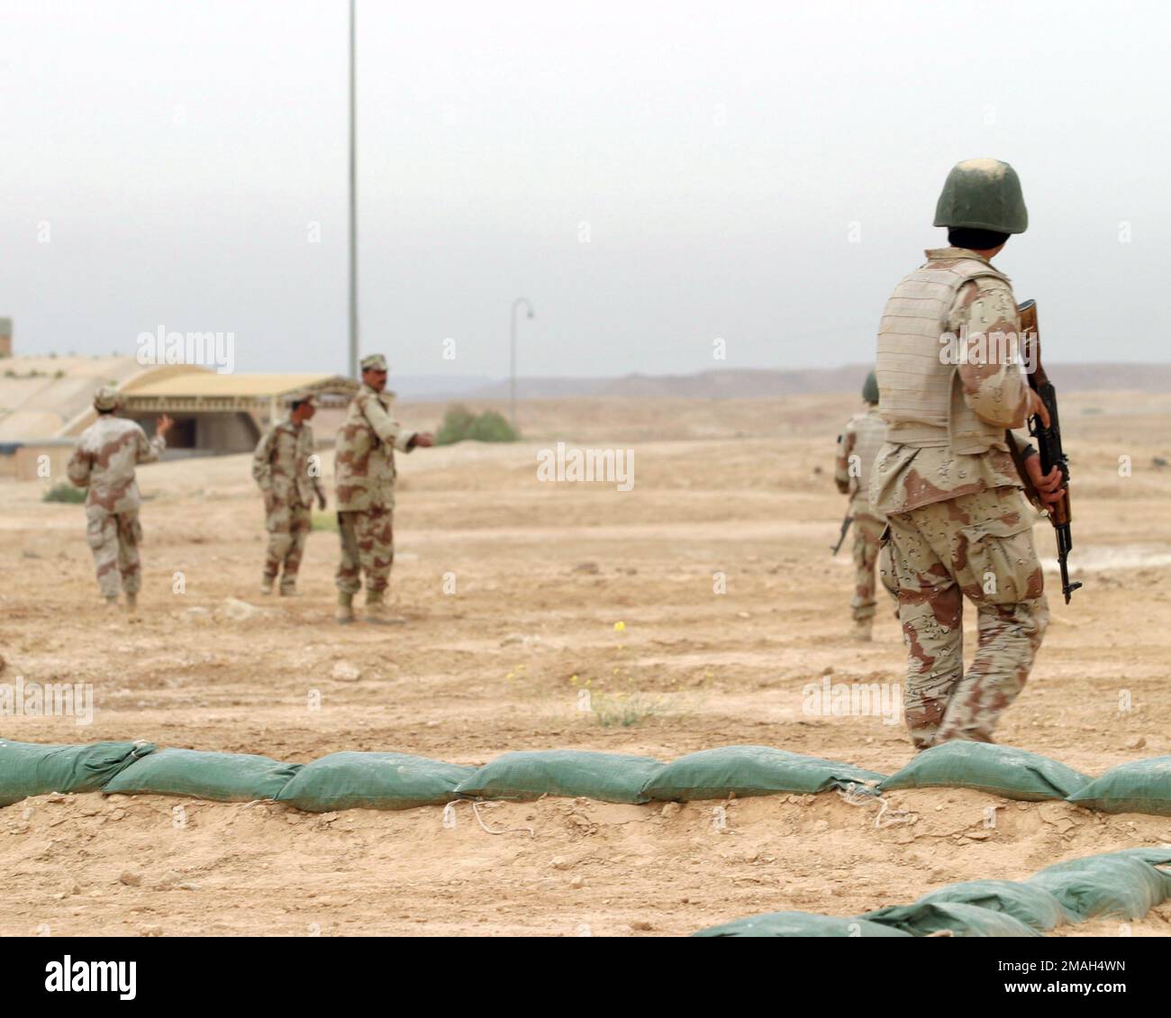 070324-M-2166H-020. [Complete] Scene Caption: An Iraqi Army Soldier in ...