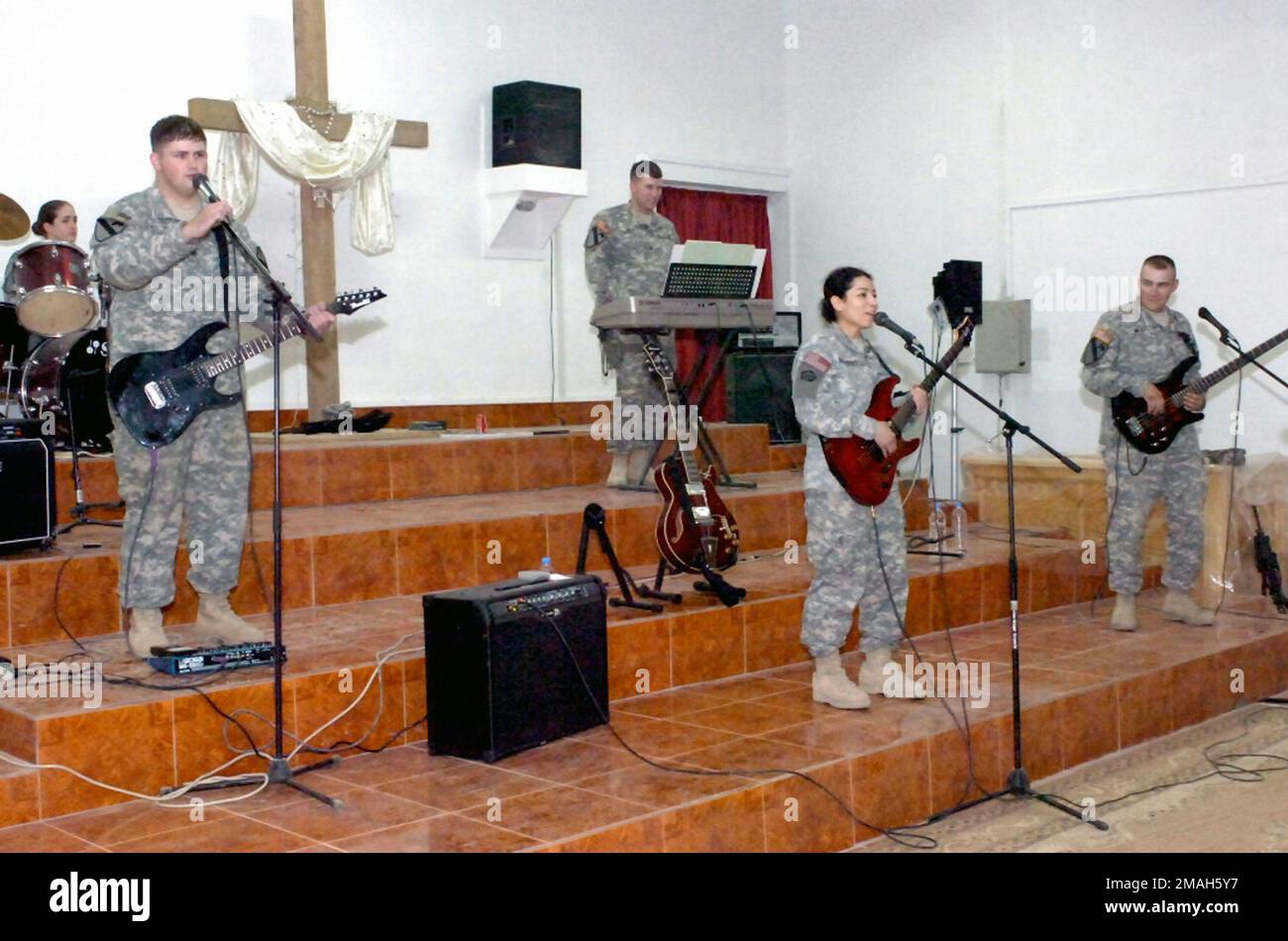 070413-A-1848T-002. [Complete] Scene Caption: Five U.S. Army troops of ...