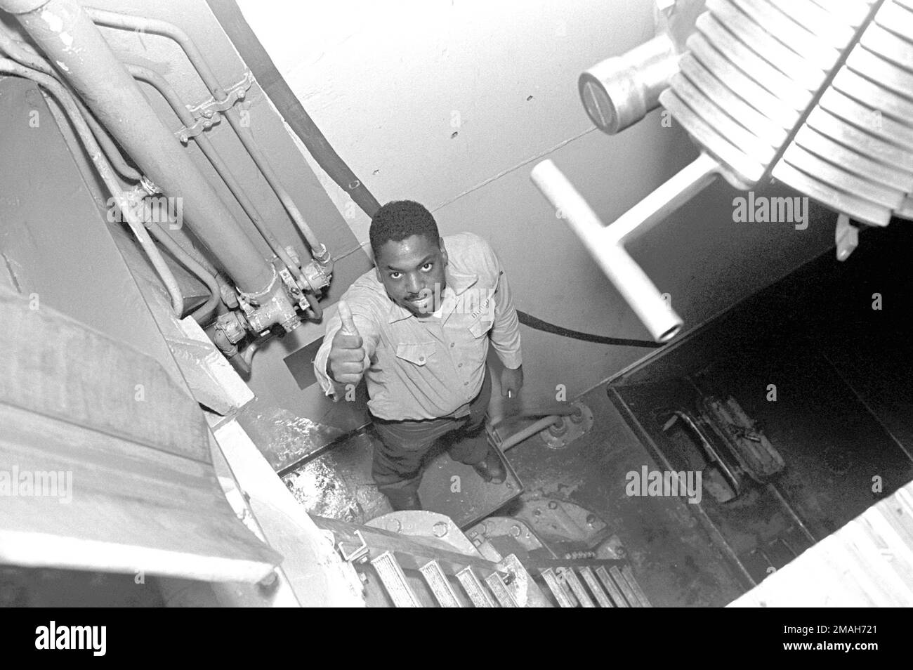 Yeoman 3rd Class Burch, the primer man for one of the Mark 7 16-inch/50 ...