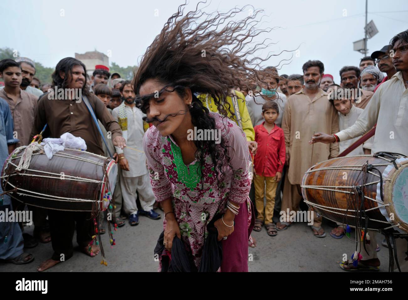 A devotee performs a traditional dance called 'Dhamaal' during ...