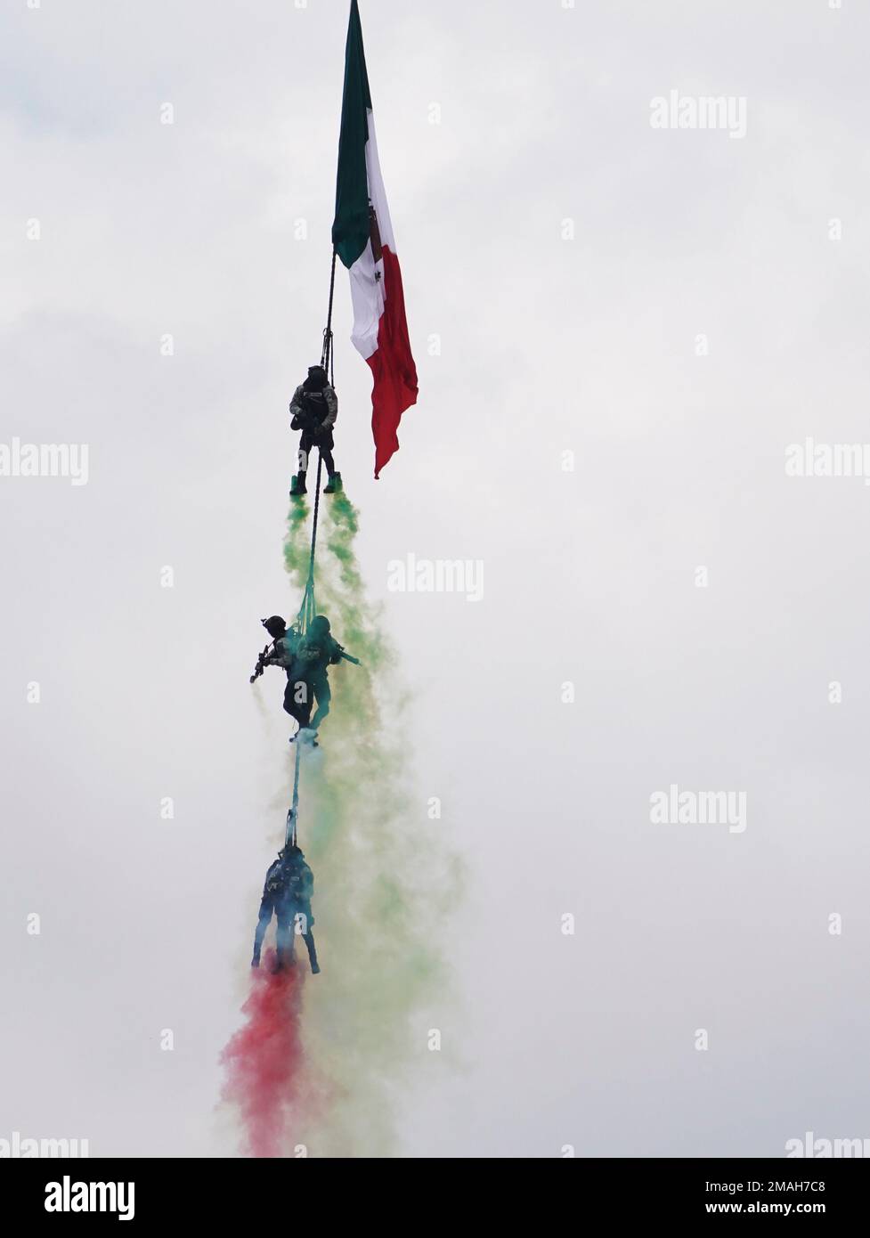Special forces, billowing smoke in the colors of the Mexican flag, hang ...