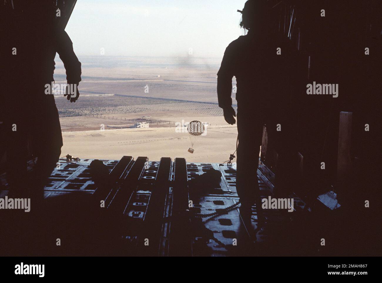 US Air Force personnel perform a heavy drop over the desert of Egypt ...