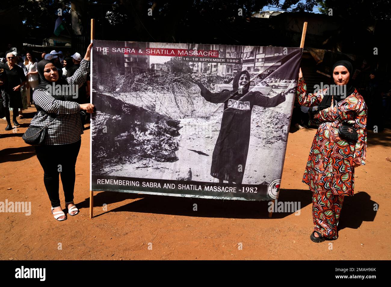Palestinian activists hold a banner to commemorate the 40th anniversary ...