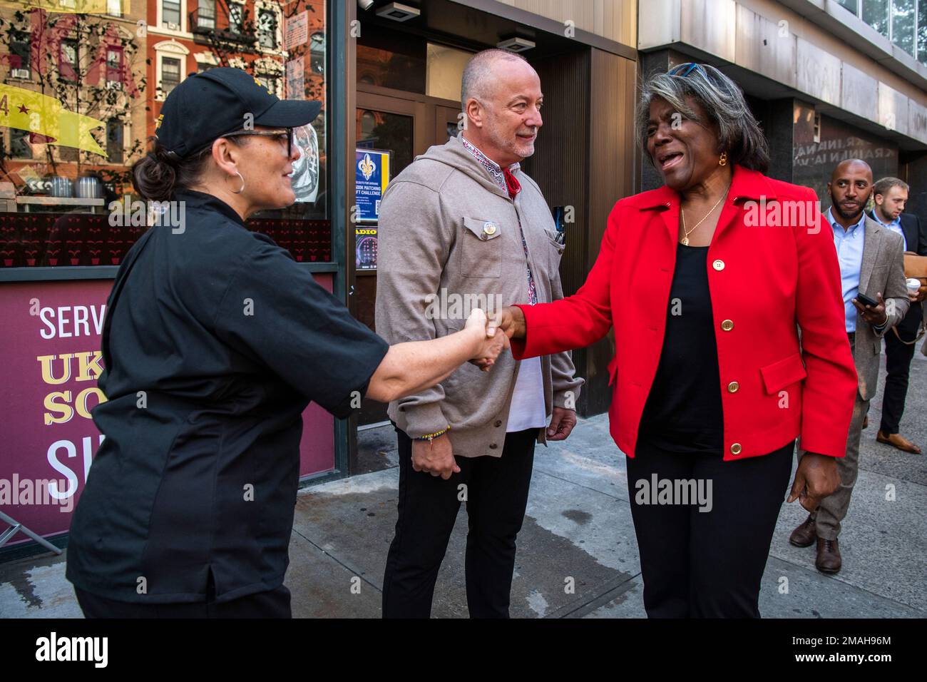(Left to right) Veselka chef Olesia Lew shakes hands with U.S ...