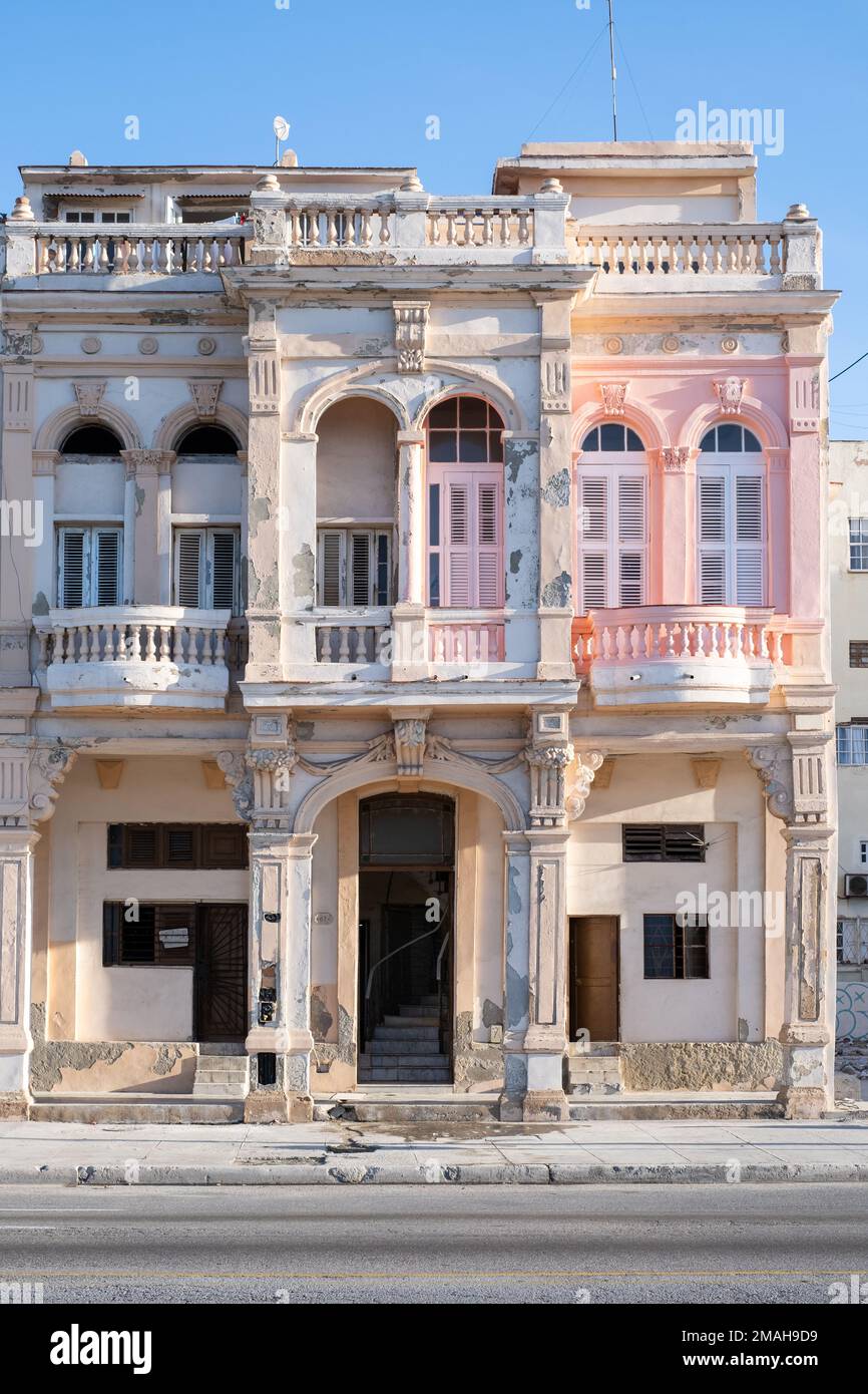Pink building on the Malecon, Havana, Cuba, as the sun sets Stock Photo ...