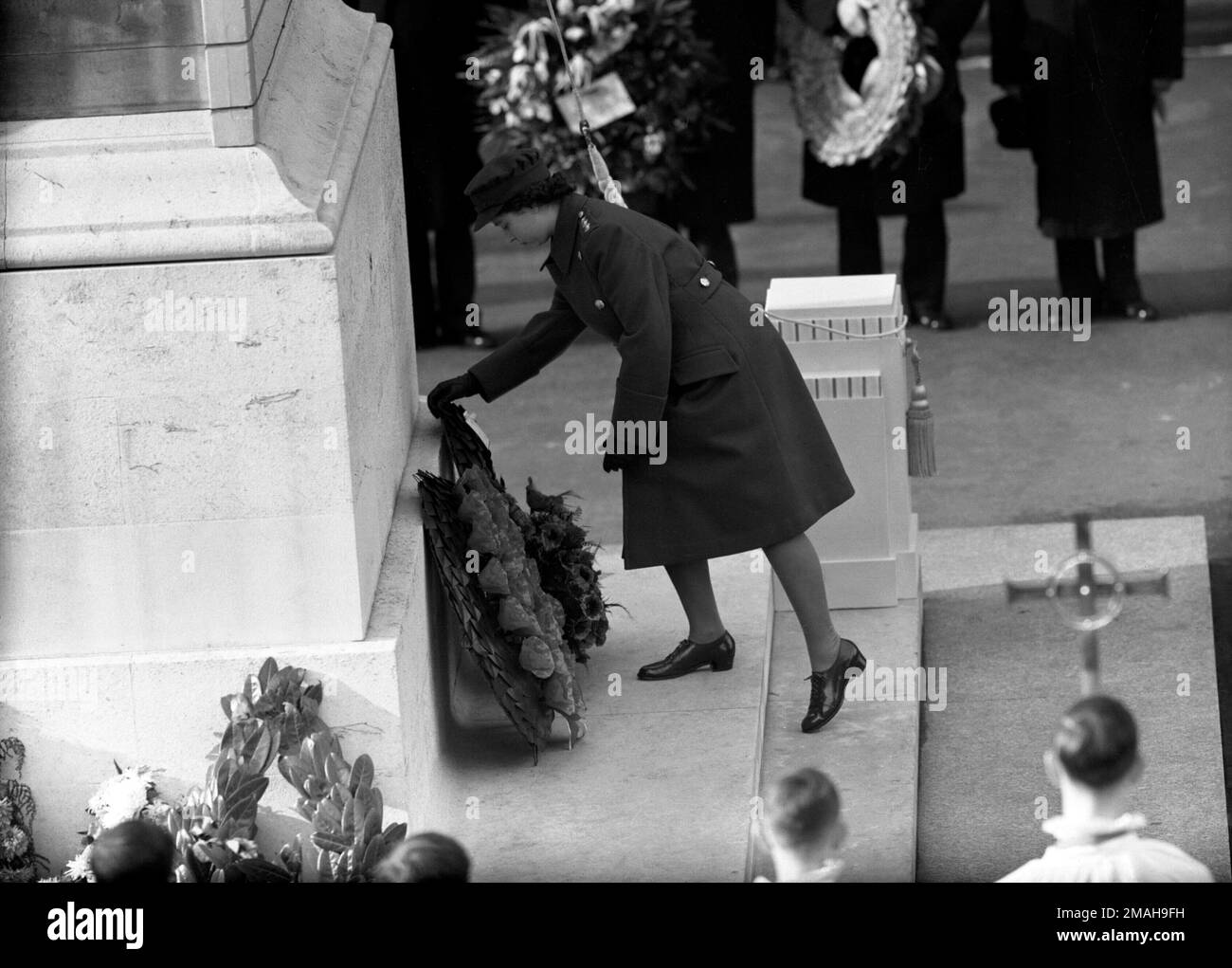 FILE - Princess Elizabeth, wearing ATS uniform, lays her wreath at the ...