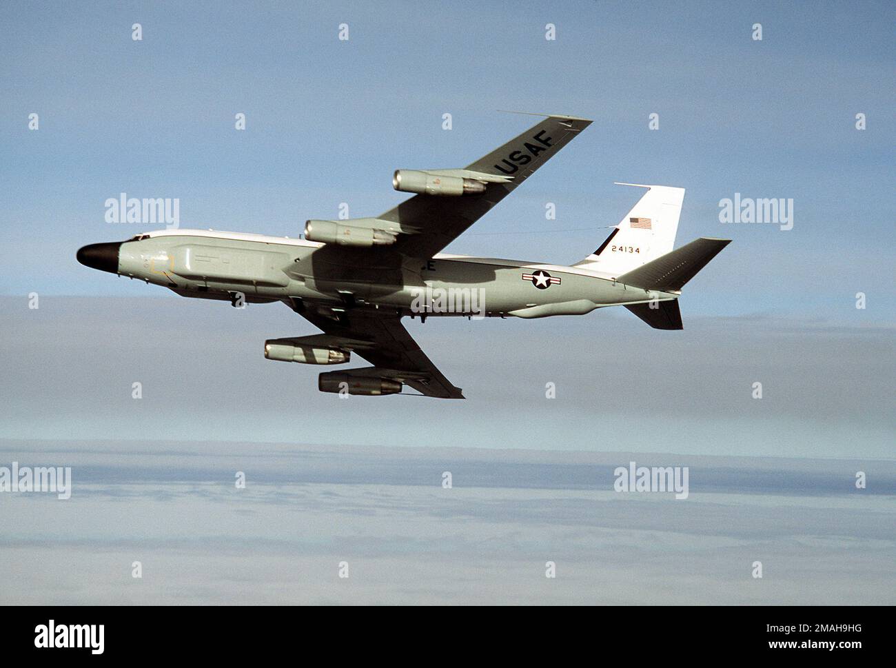 A left side air-to-air view of an RC-135W Stratolifter advance airborne ...