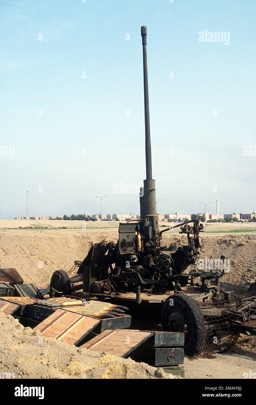 An abandoned Iraqi S-60 57mm automatic anti-aircraft gun stands at an ...