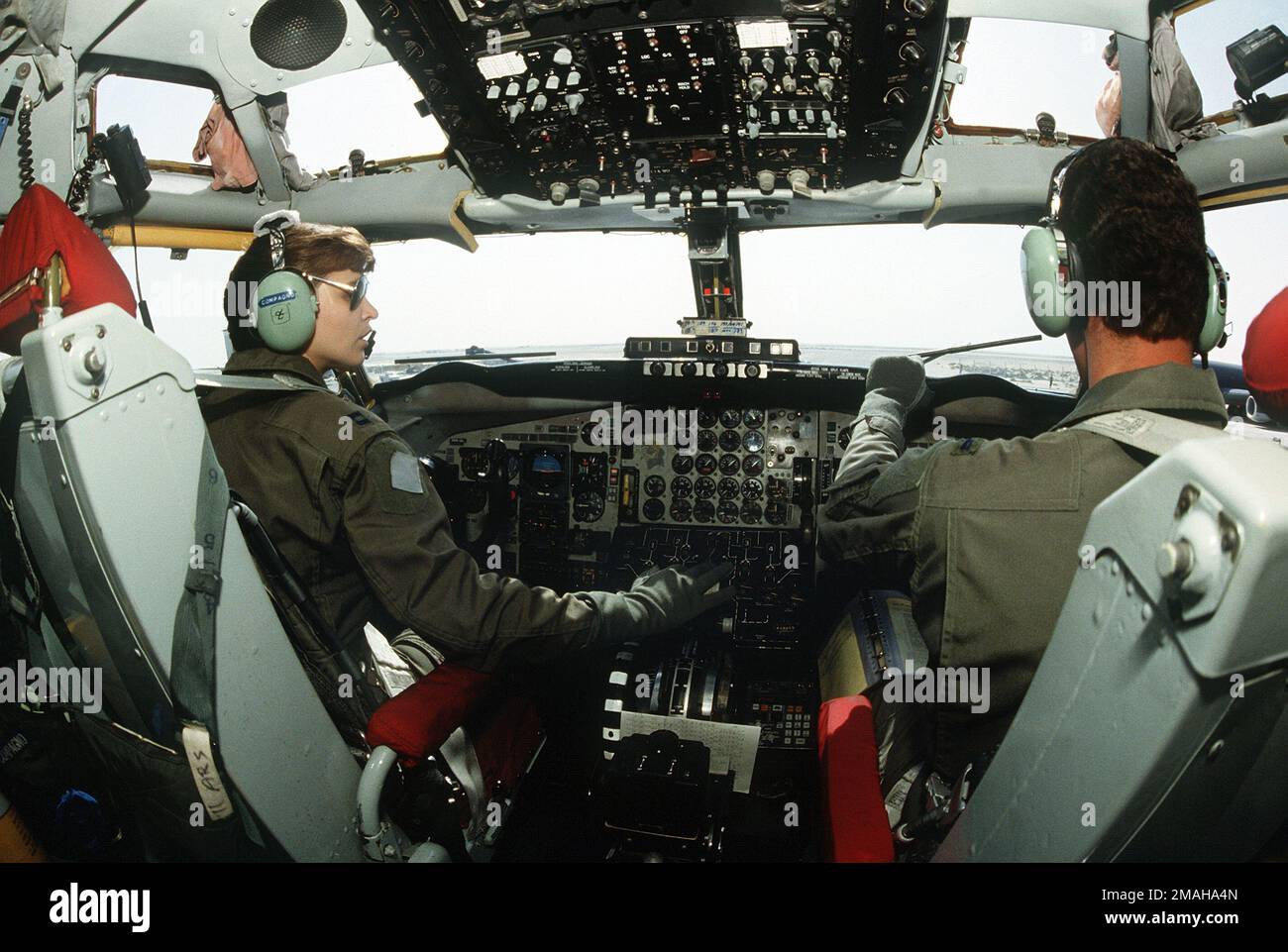 CAPT. Mavis Compagno, pilot, and LT. Eric Ross, co-pilot, monitor ...