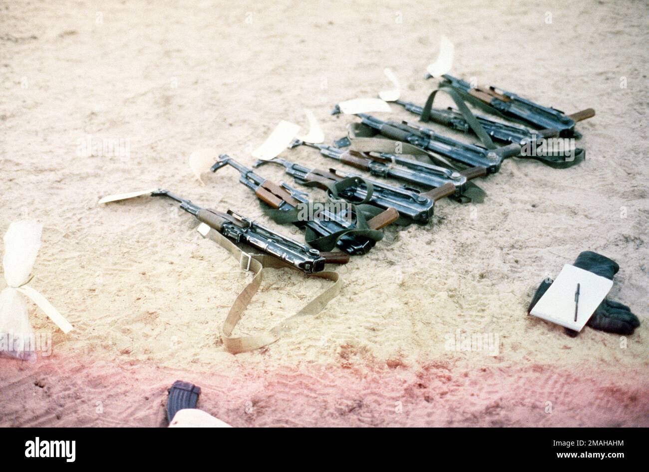 Captured AKM assault rifles are tagged and displayed during Operation ...