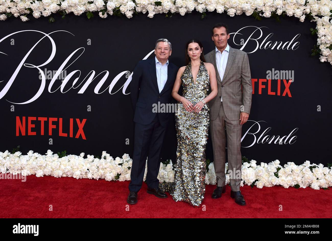 Ted Sarandos, Ana de Armas and Scott Stuber arrive at the premiere of ...