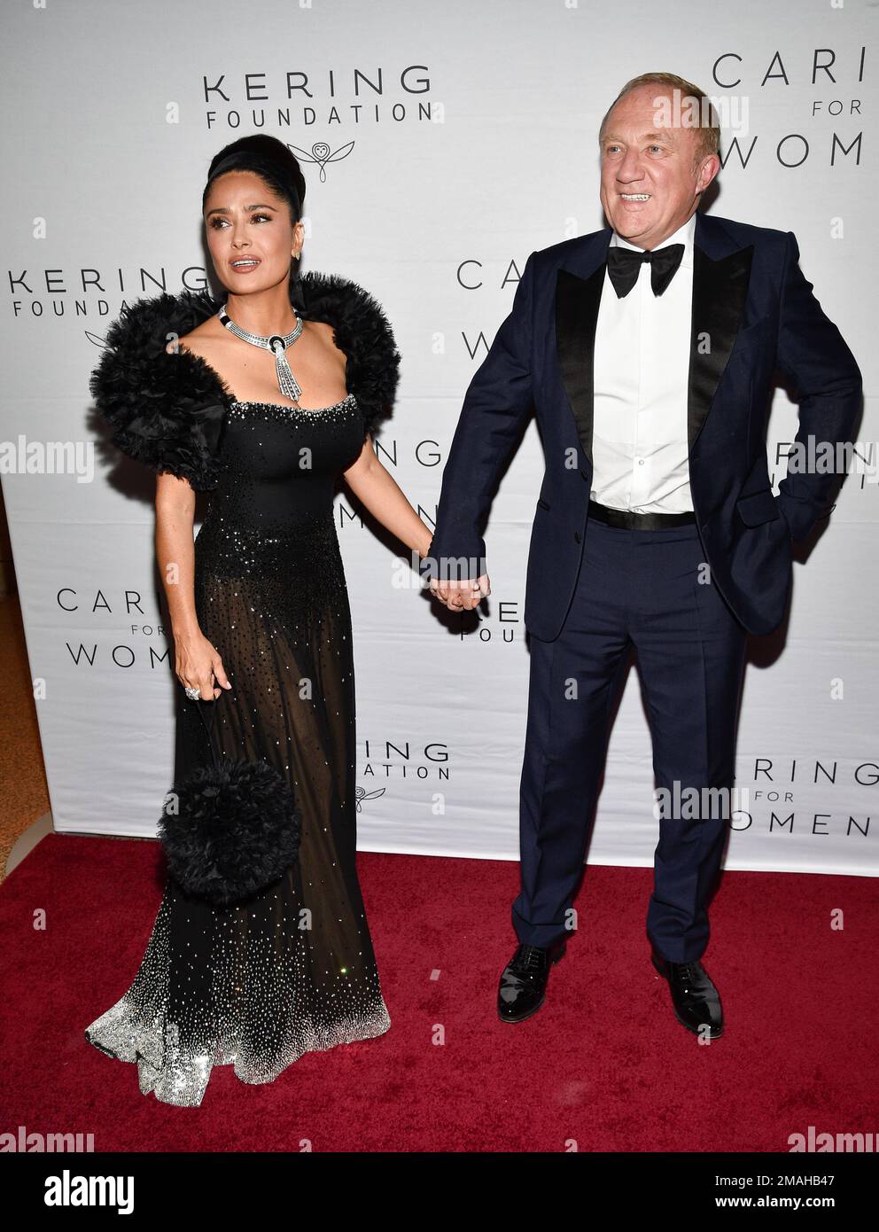 Salma Hayek Pinault, left, and husband Francois-Henri Pinault attend ...