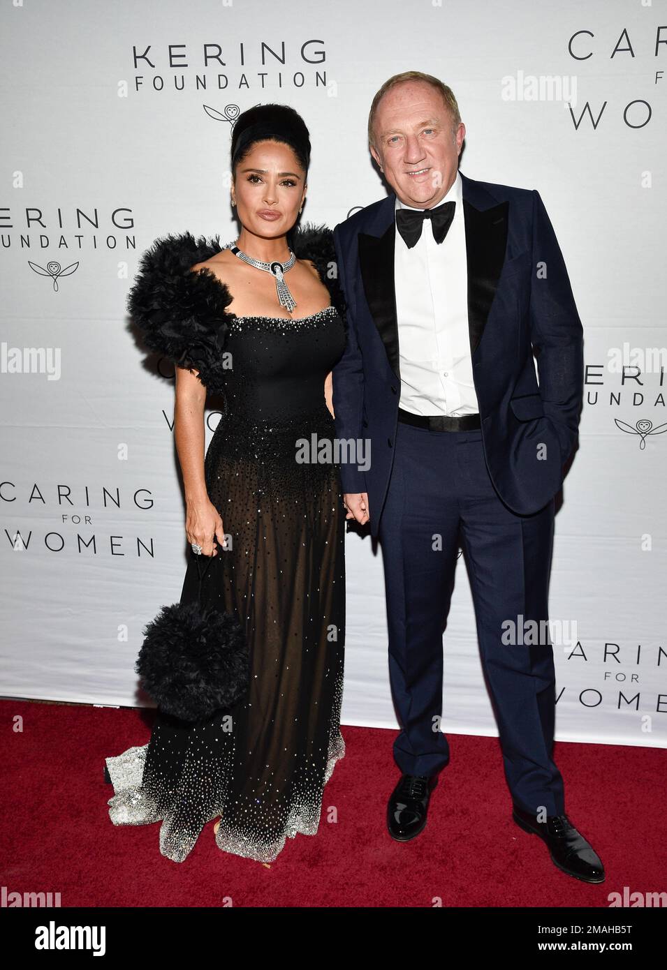 Salma Hayek Pinault, left, and husband Francois-Henri Pinault attend ...