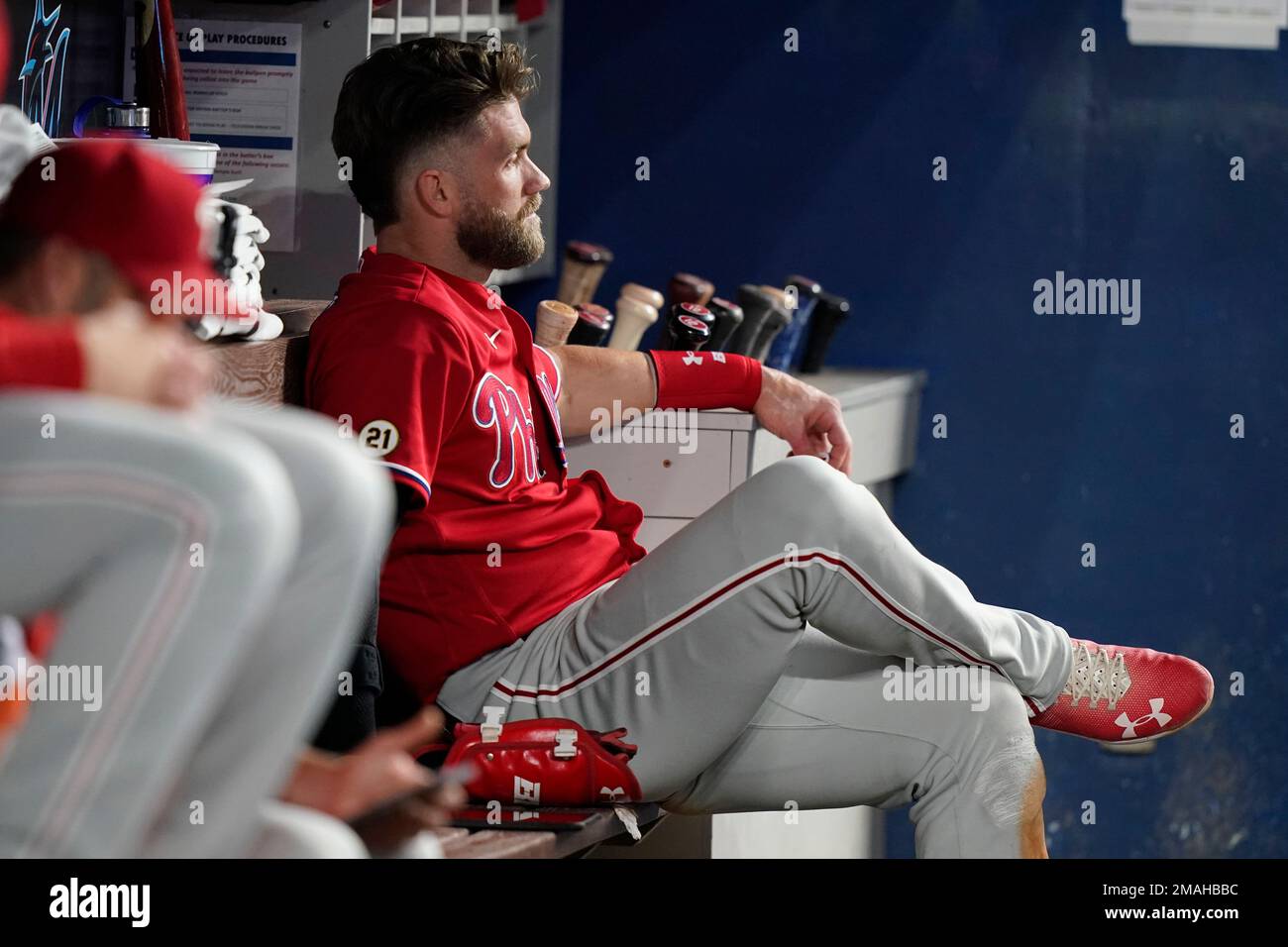 Philadelphia Phillies' Bryce Harper sits in the dugout during a ...