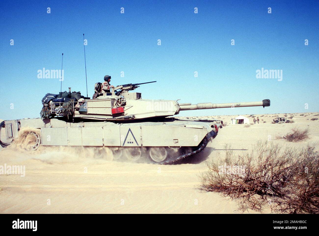 The gunner mans a machine gun from the turret of an M-1 Abrams main ...