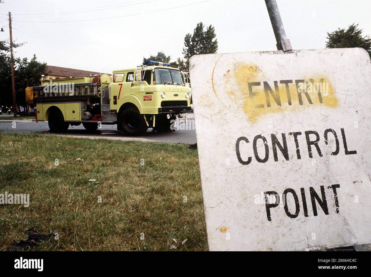 A firefighting vehicle is deployed behind the 435th Tactical Air Wing ...