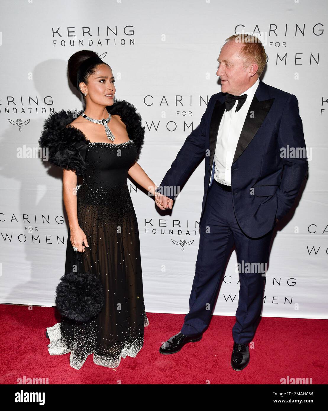 Salma Hayek Pinault, left, and husband Francois-Henri Pinault attend ...