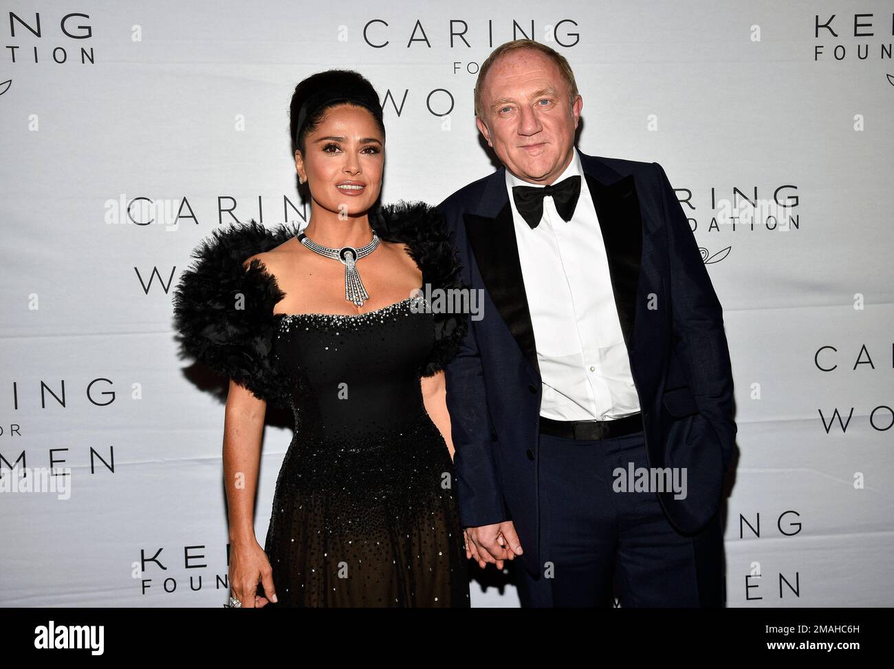 Salma Hayek Pinault, left, and husband Francois-Henri Pinault attend ...