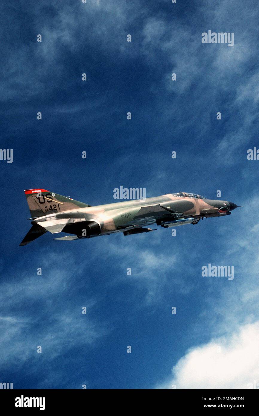 An air-to-air right side view of an F-4E Phantom II aircraft of the ...