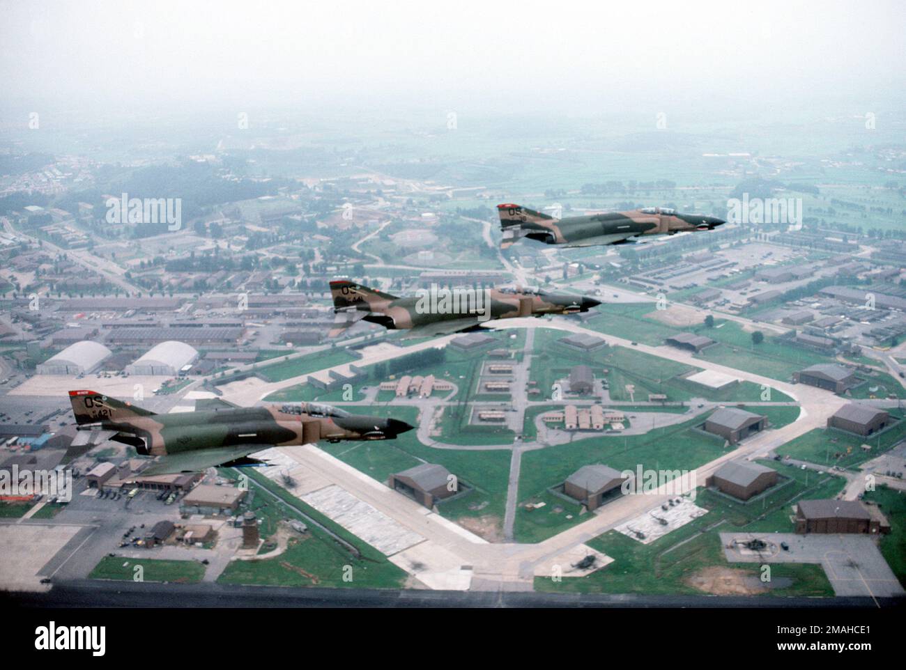 An air-to-air right side view of three F-4E Phantom II aircraft of the ...