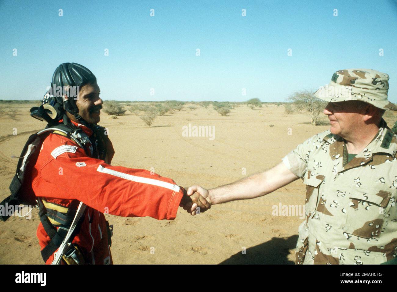 An Egyptian paratrooper shakes hands with LT. GEN. Robert C. Kingston ...