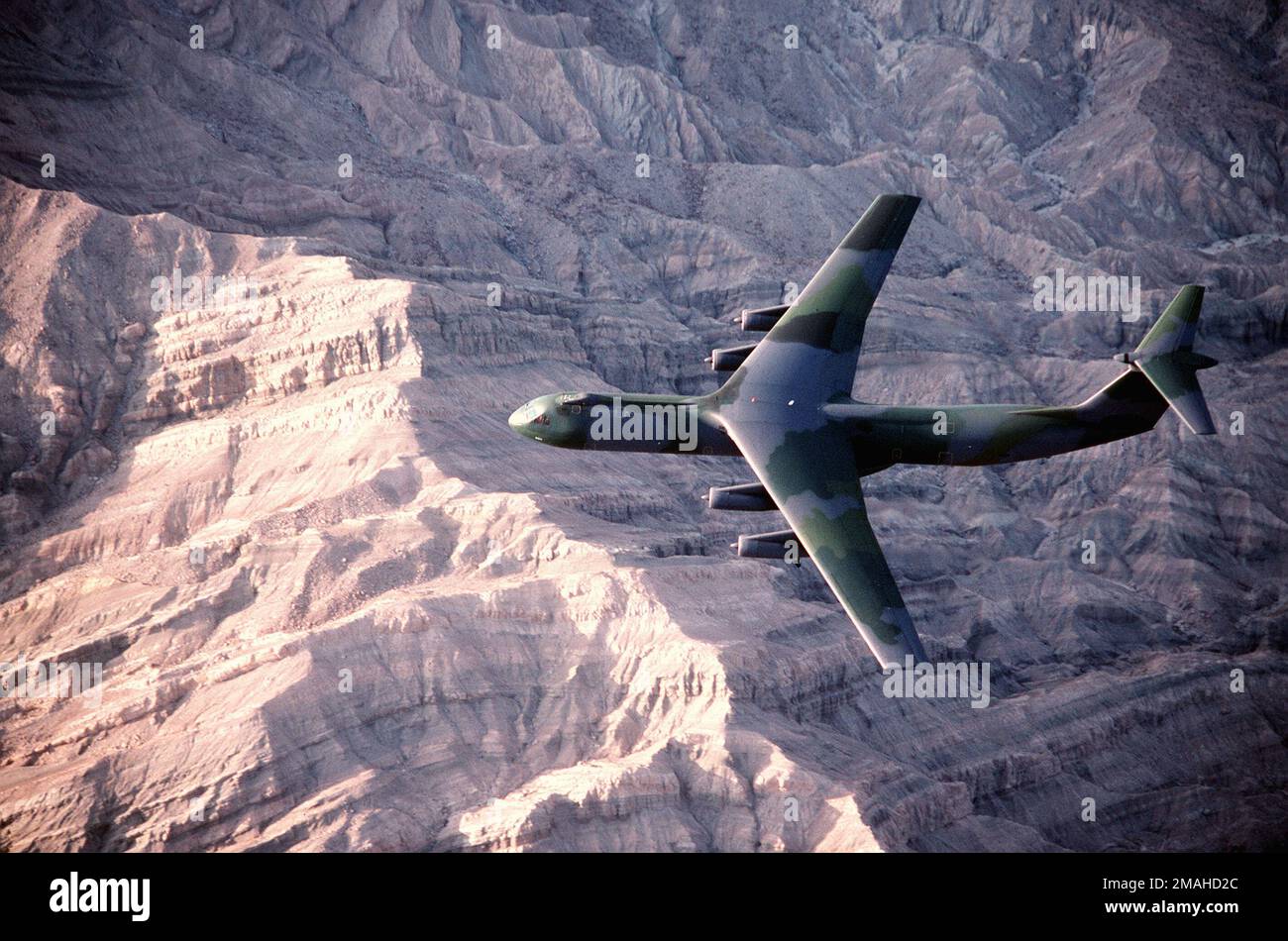 AN air-to-air overhead view of a C-141B Starlifter aircraft with the ...