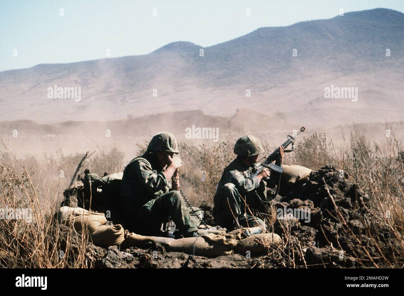 Two Marines guard the battalion perimeter from advance post positions ...