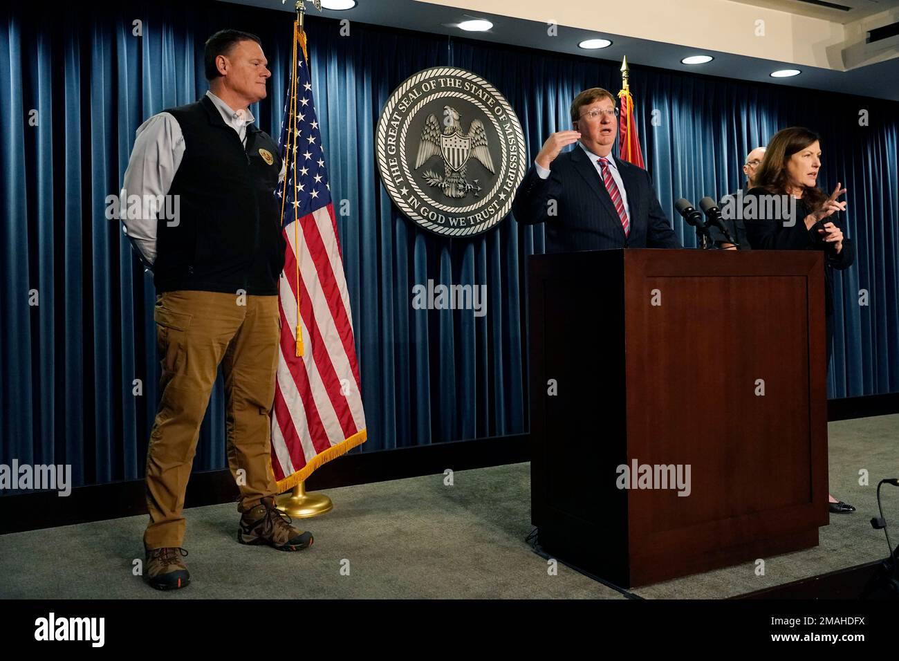 Mississippi Gov. Tate Reeves, center, announces the state imposed boil ...
