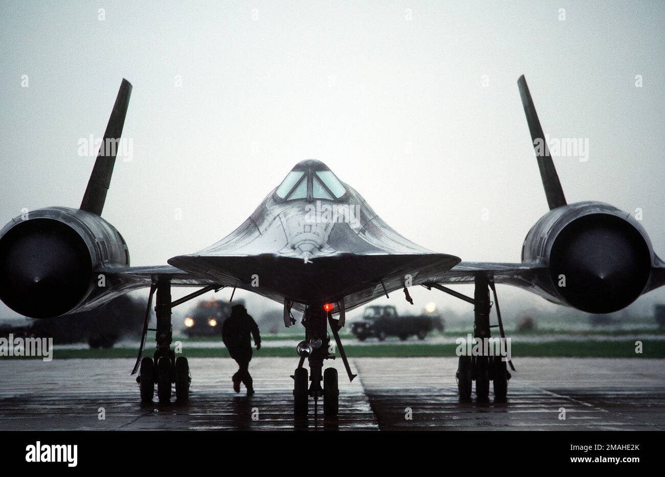 A front view of an SR-71 Blackbird aircraft being prepared for takeoff ...