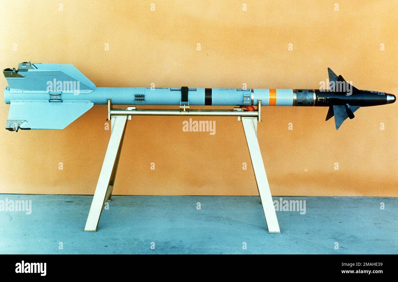 A left side view of an AIM-9L/M Sidewinder missile on a display stand ...