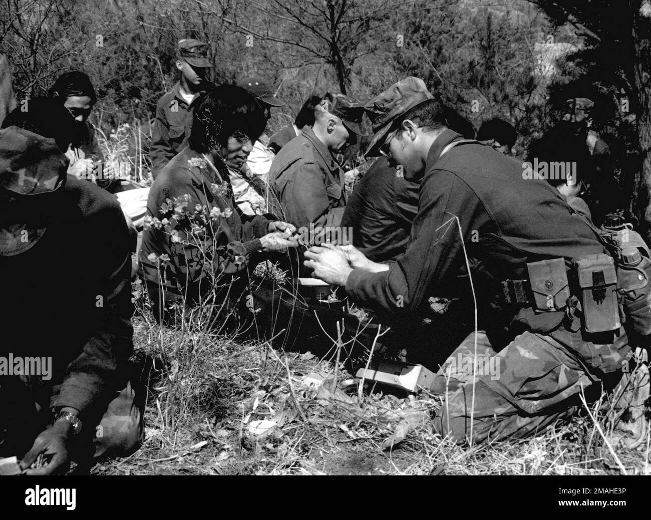 U.S. Marines show a group of South Korean newsmen how to prepare ...