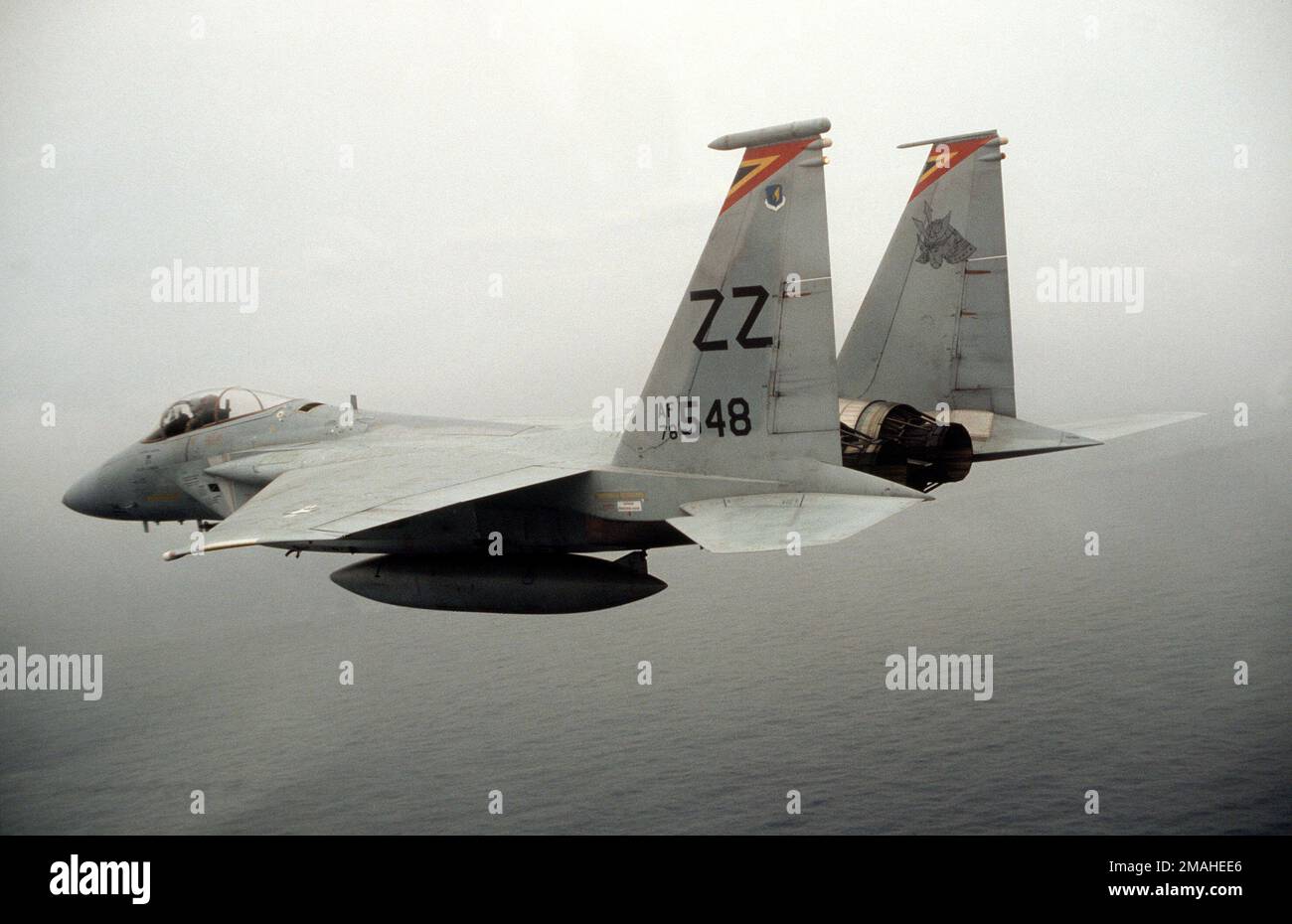 An air-to-air left rear view of an F-15 Eagle aircraft assigned to the ...