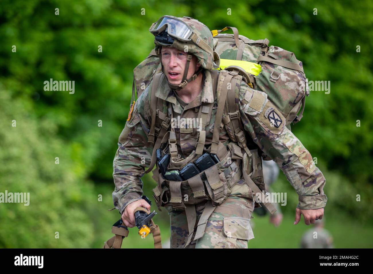 Soldiers with 10th Mountain Division complete a ruck march as part of ...