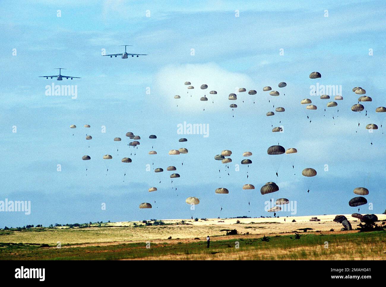 Two groups of paratroopers from the 82nd Airborne Division drift to the ...