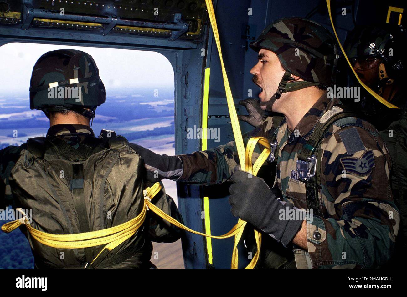 Under the direction of STAFF Sergeant John P. Hosey, right, a ...