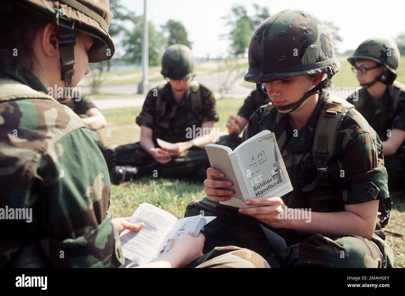 Female recruits study their Soldier's Handbooks before a test. Base ...