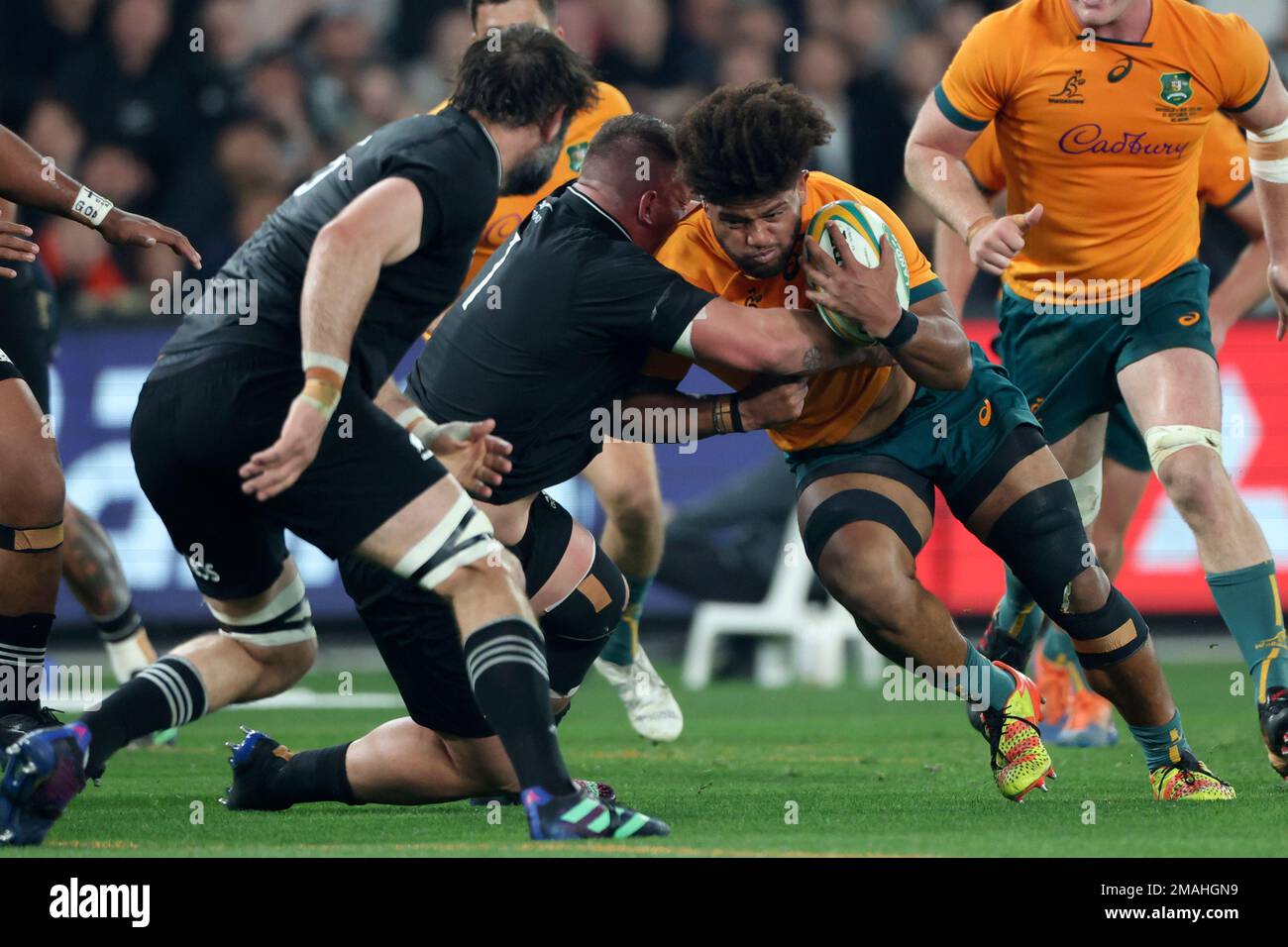 Australia's Rob Valetini, right, drives through New Zealand's Ethan de ...