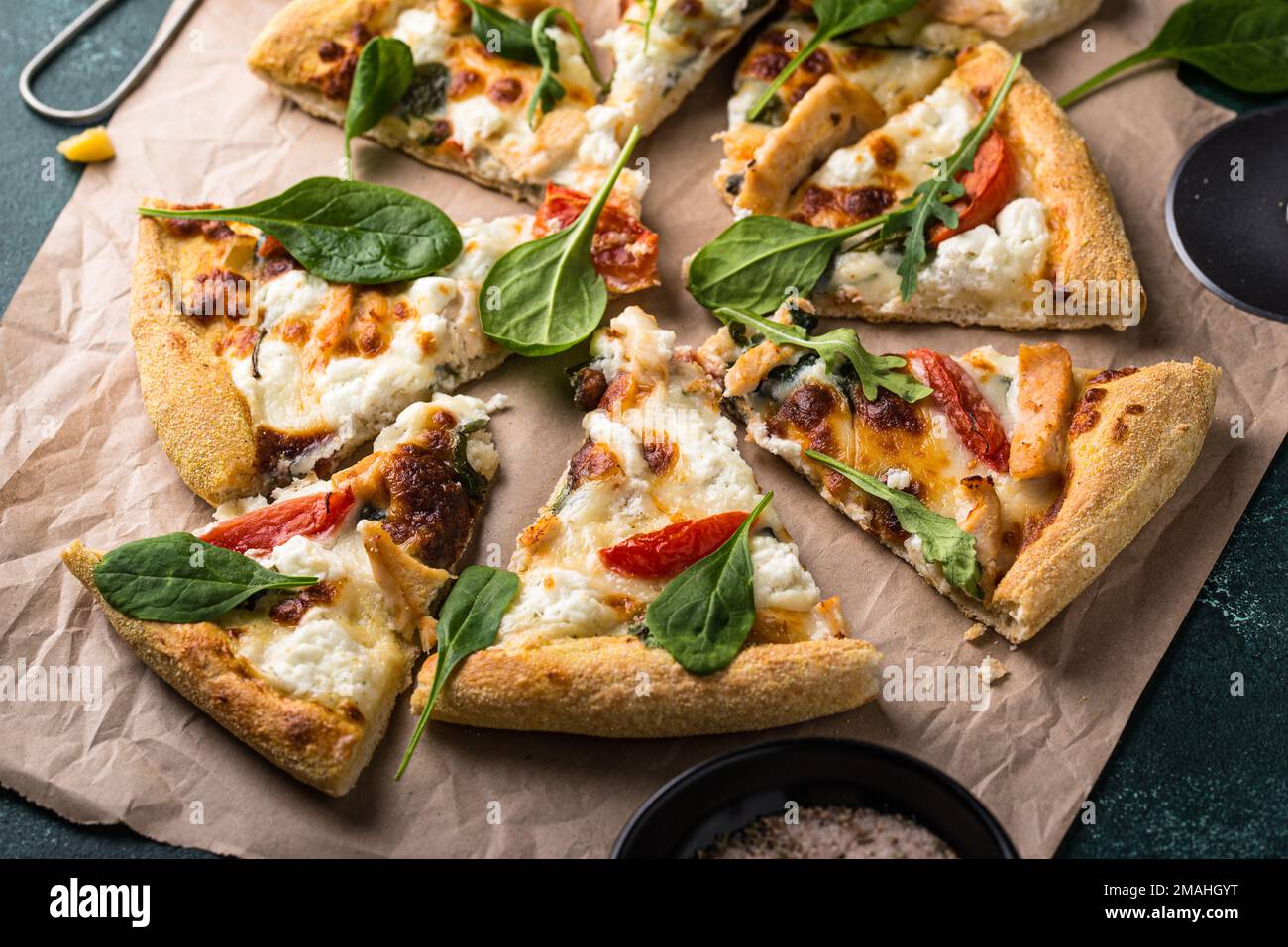 Italian pizza with feta cheese, tomato and basil Stock Photo - Alamy