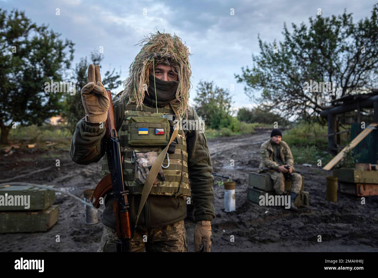 Ukrainian serviceman "Syvyi" guards his position at the checkpoint in ...