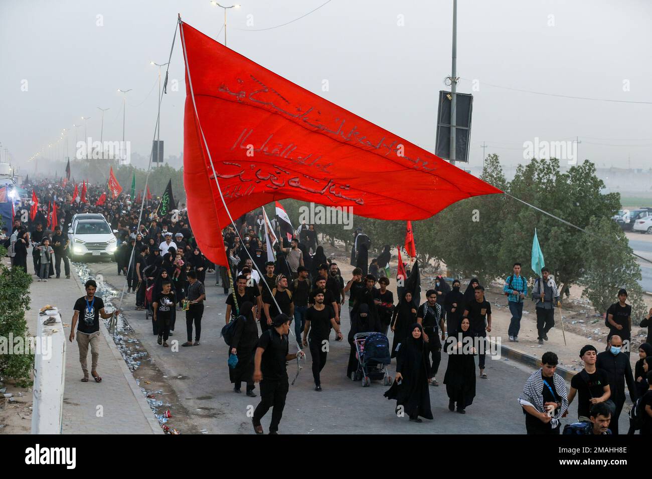 Shiite pilgrims walk to then city of Karbala, Iraq, to mark the holiday ...