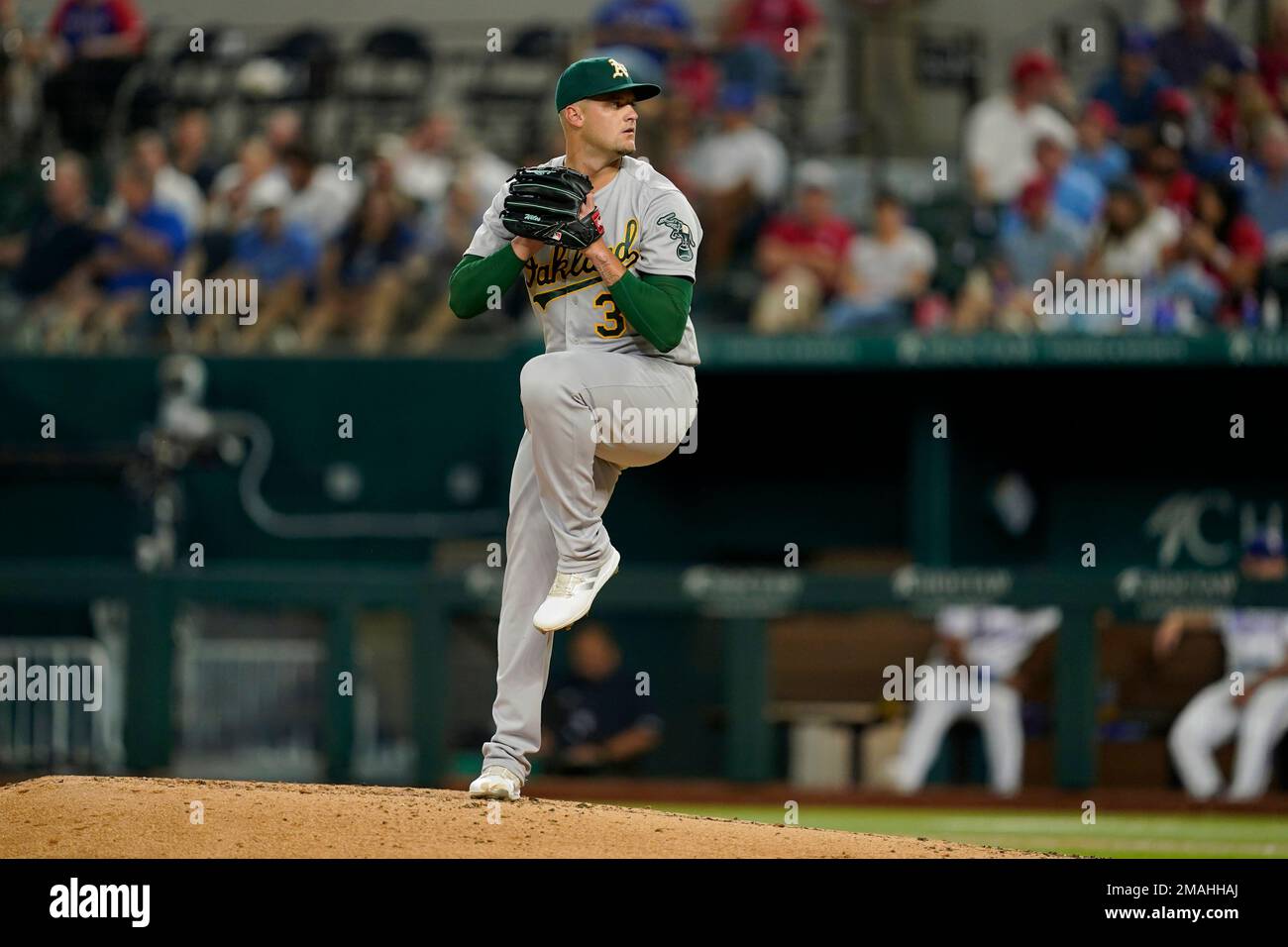 Oakland Athletics relief pitcher Collin Wiles throws to the Texas ...