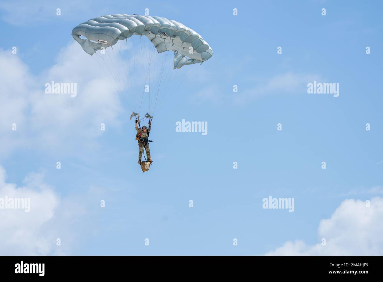 A parachutist on the U.S. Army Special Operations Command parachute ...