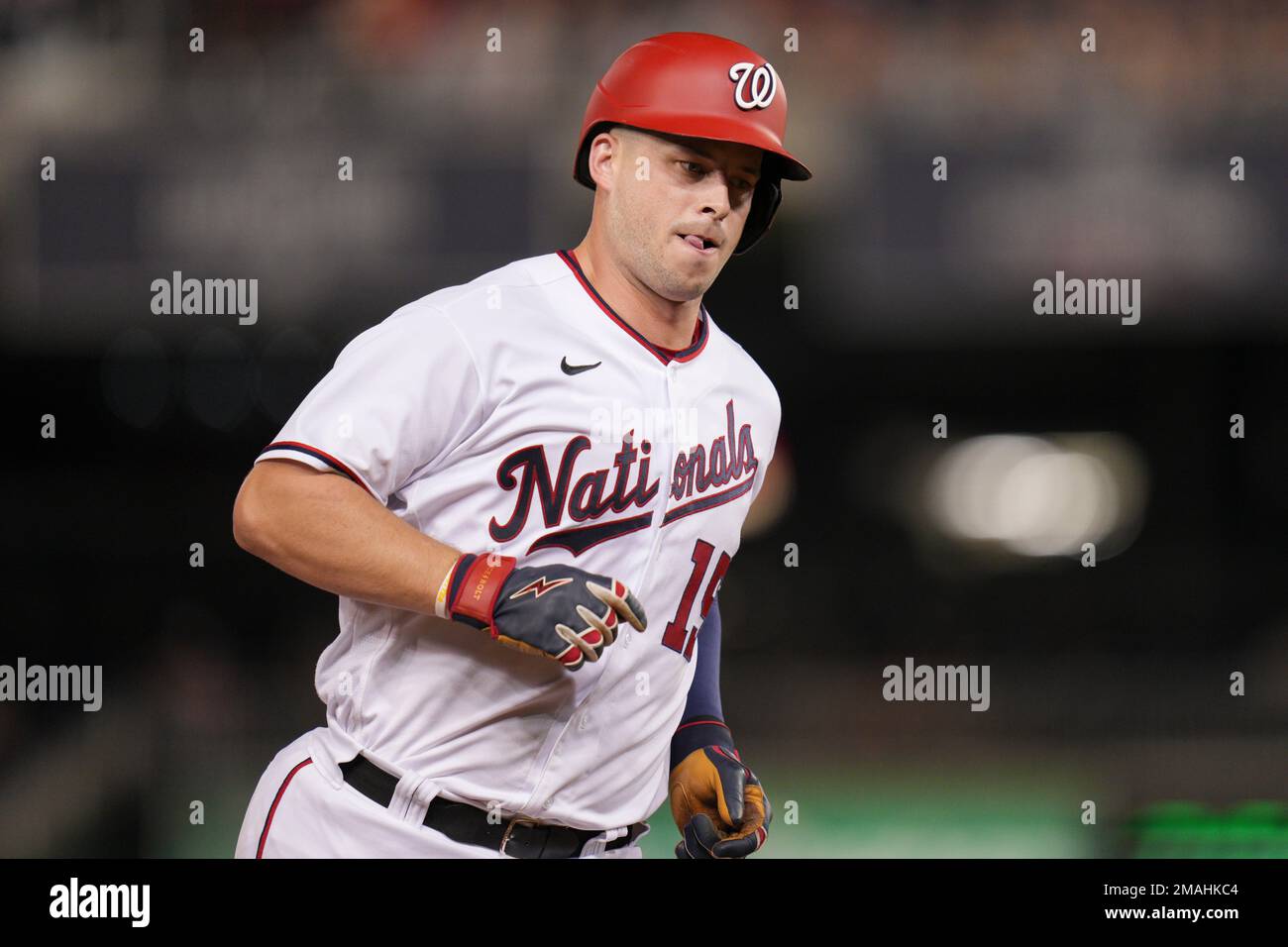 Washington Nationals' Riley Adams rounds third base after hitting a ...