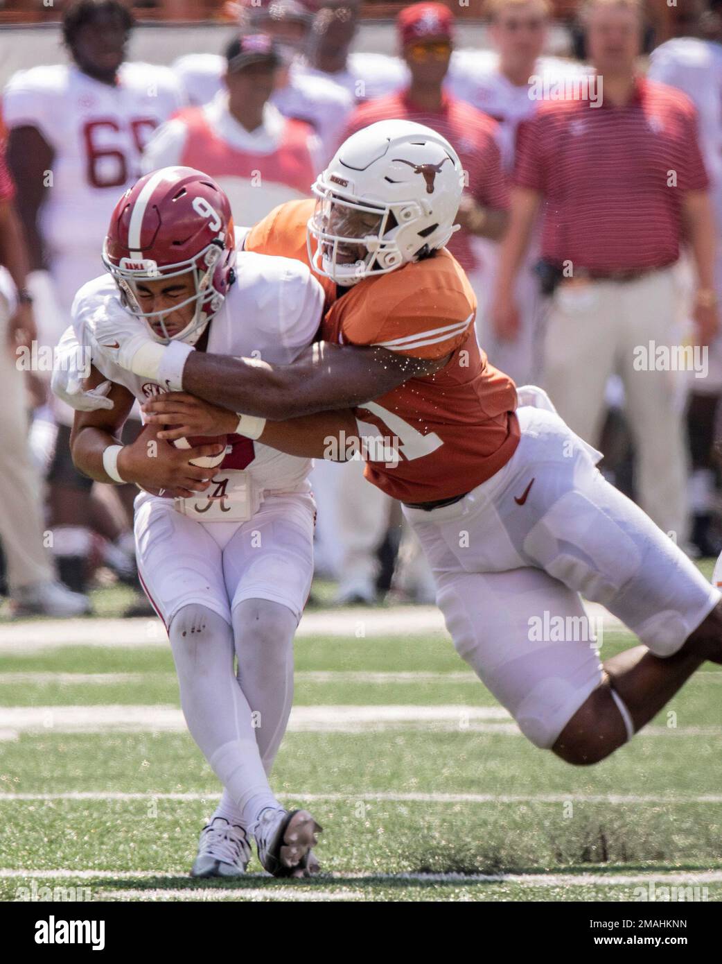 Alabama quarterback Bryce Young (9) is sacked by Texas linebacker ...