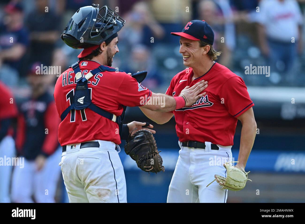 Cleveland Guardians relief pitcher James Karinchak, right, and catcher ...