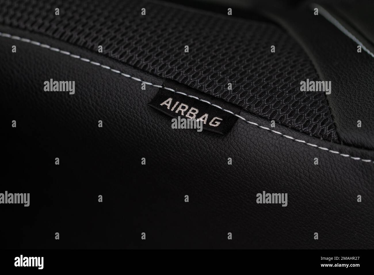 Close up view of airbag label on the side of a car seat. Airbag safety ...