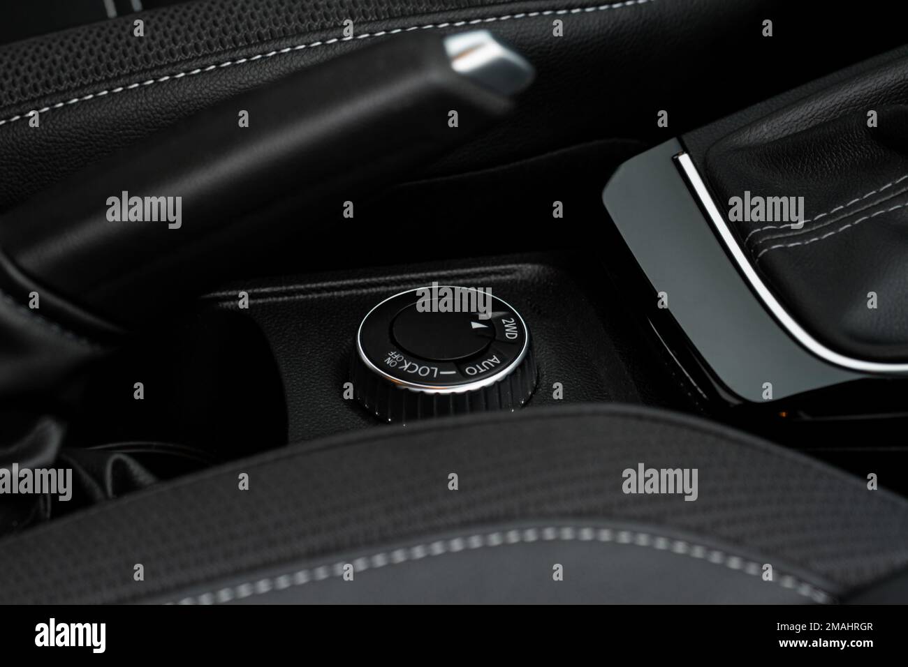 Drive selector button. Car interior, offroad drive controller closeup ...