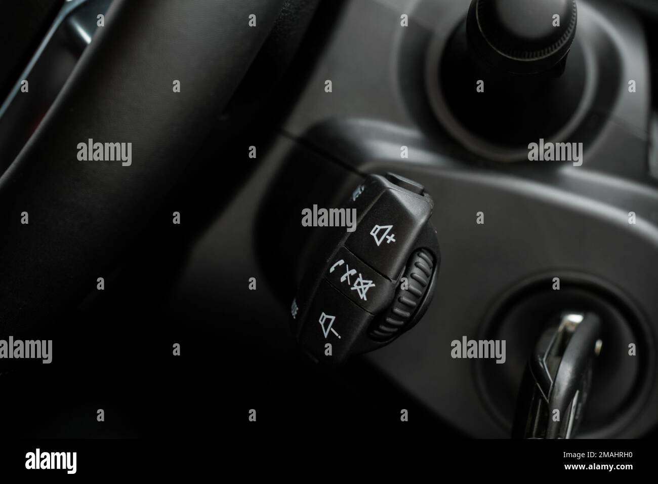 Volume and audio control buttons on the steering wheel. Car audio ...
