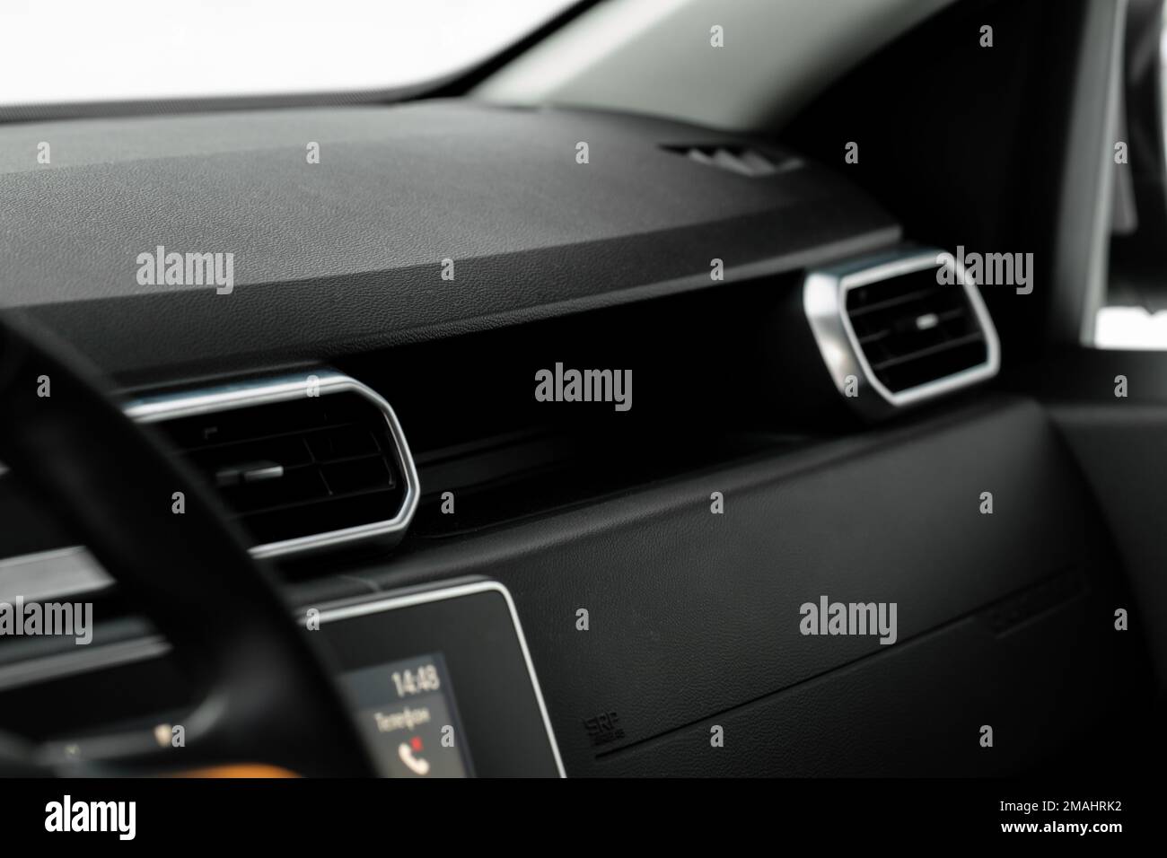 Modern car interior close up view with metallic and plastic details ...
